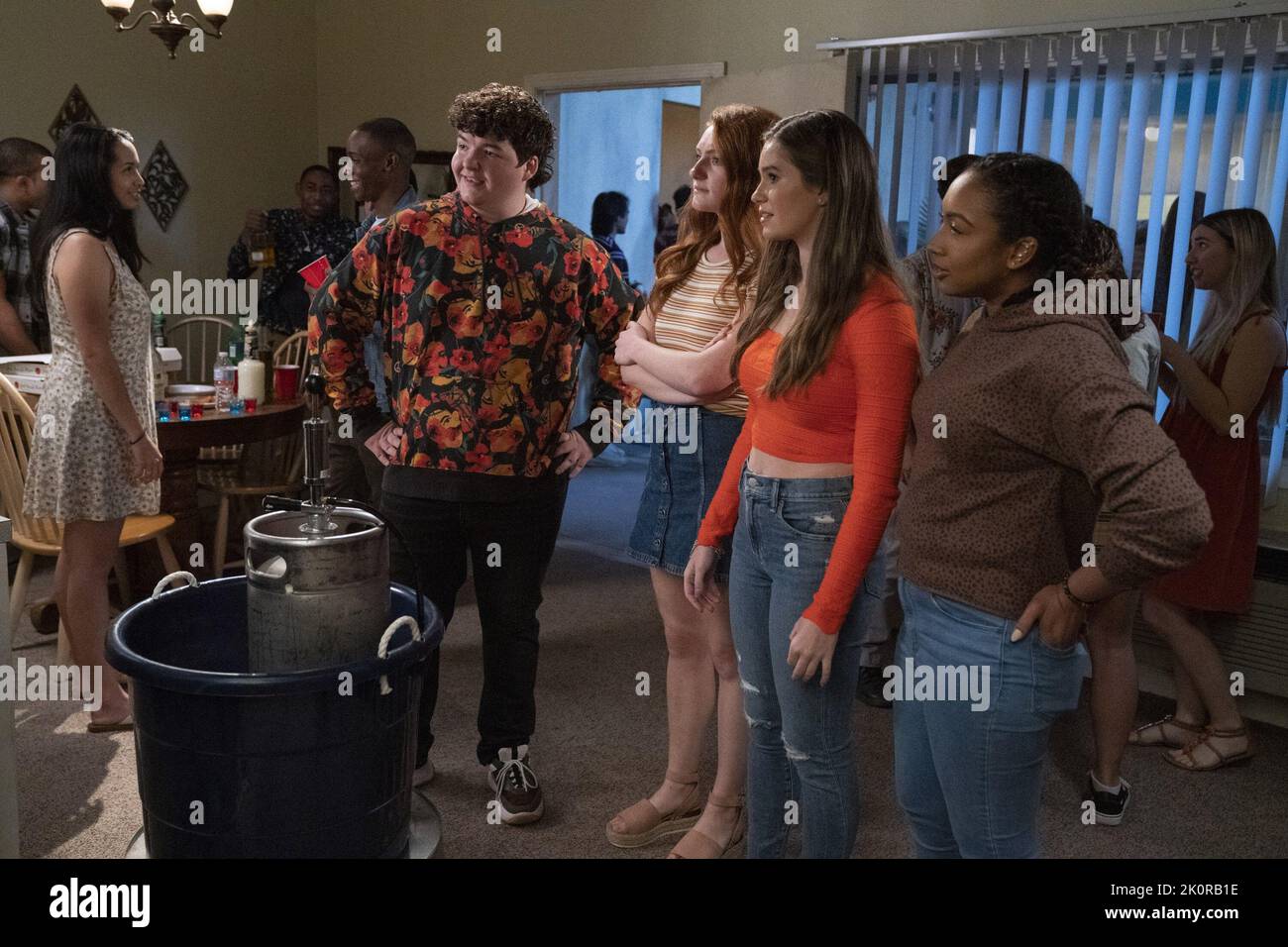 COBRA KAI, Aedin Mincks (hands on hips), Cece Kelly (orange top ...