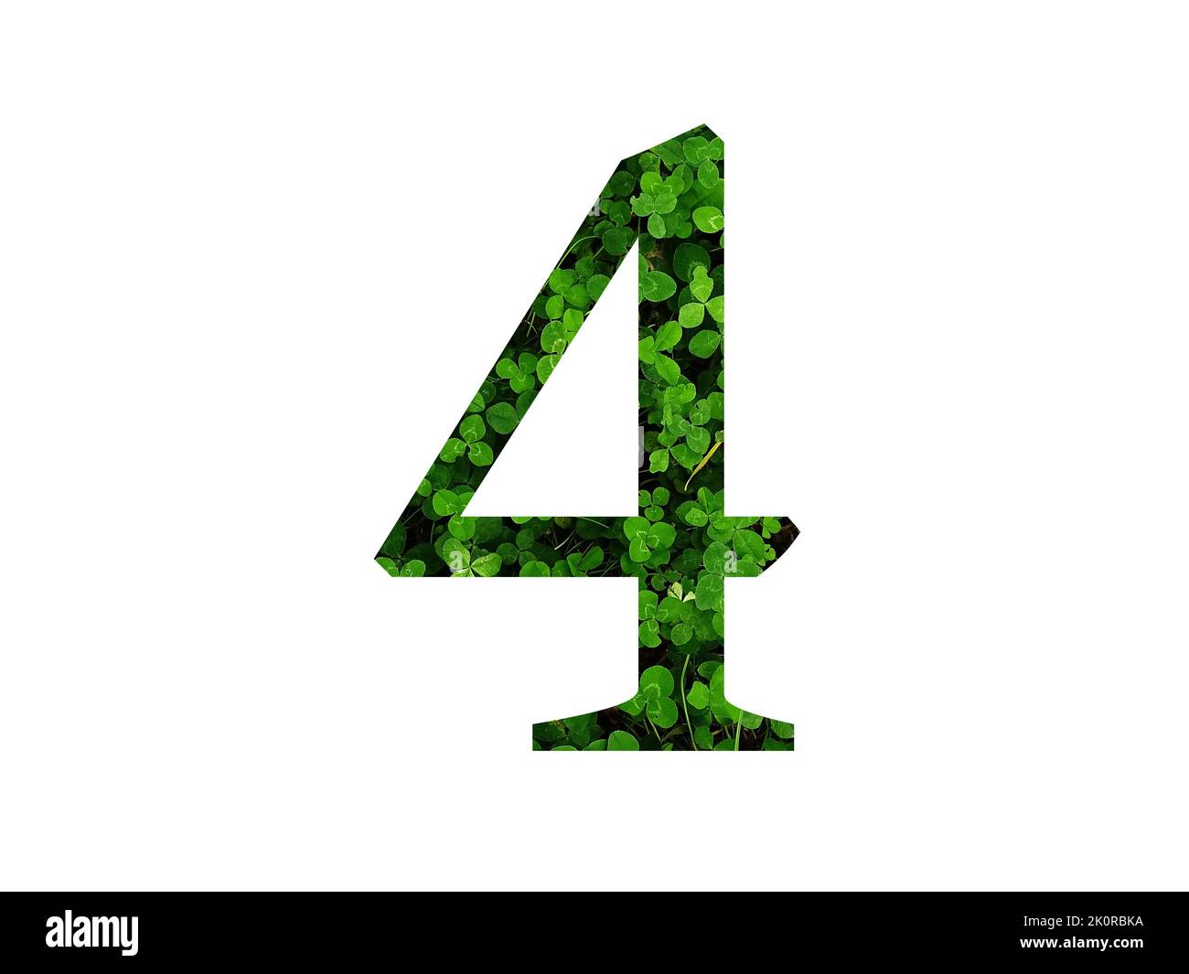 number 4 of the alphabet made with green leaf of a clover field. made ...