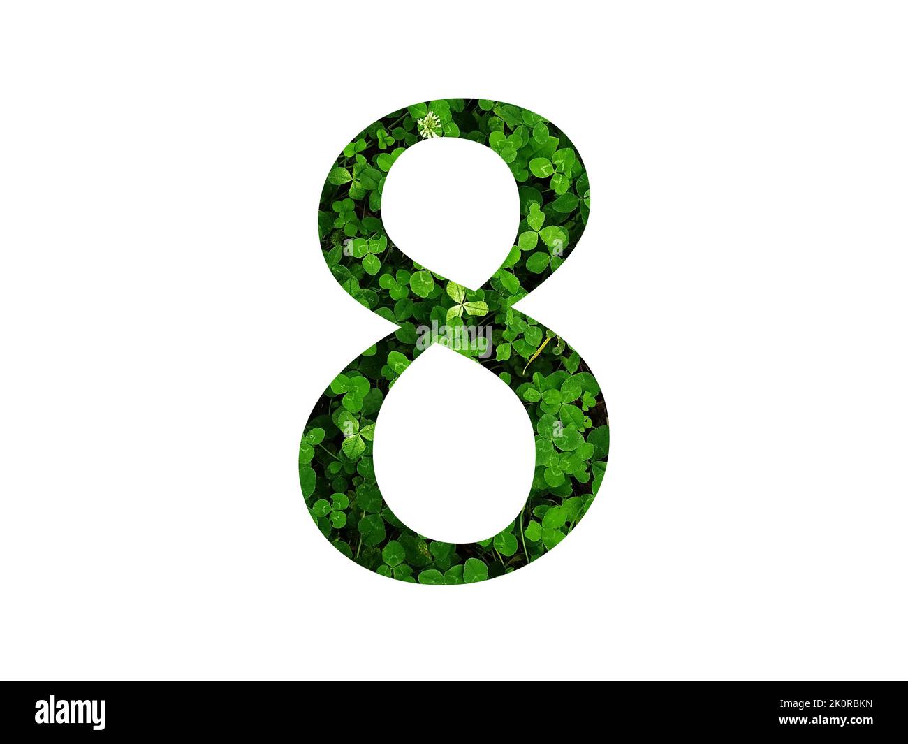 number 8 of the alphabet made with green leaf of a clover field. made ...