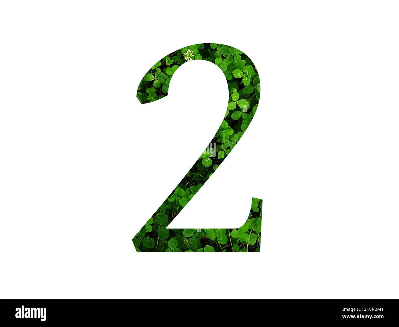number 2 of the alphabet made with green leaf of a clover field. made ...