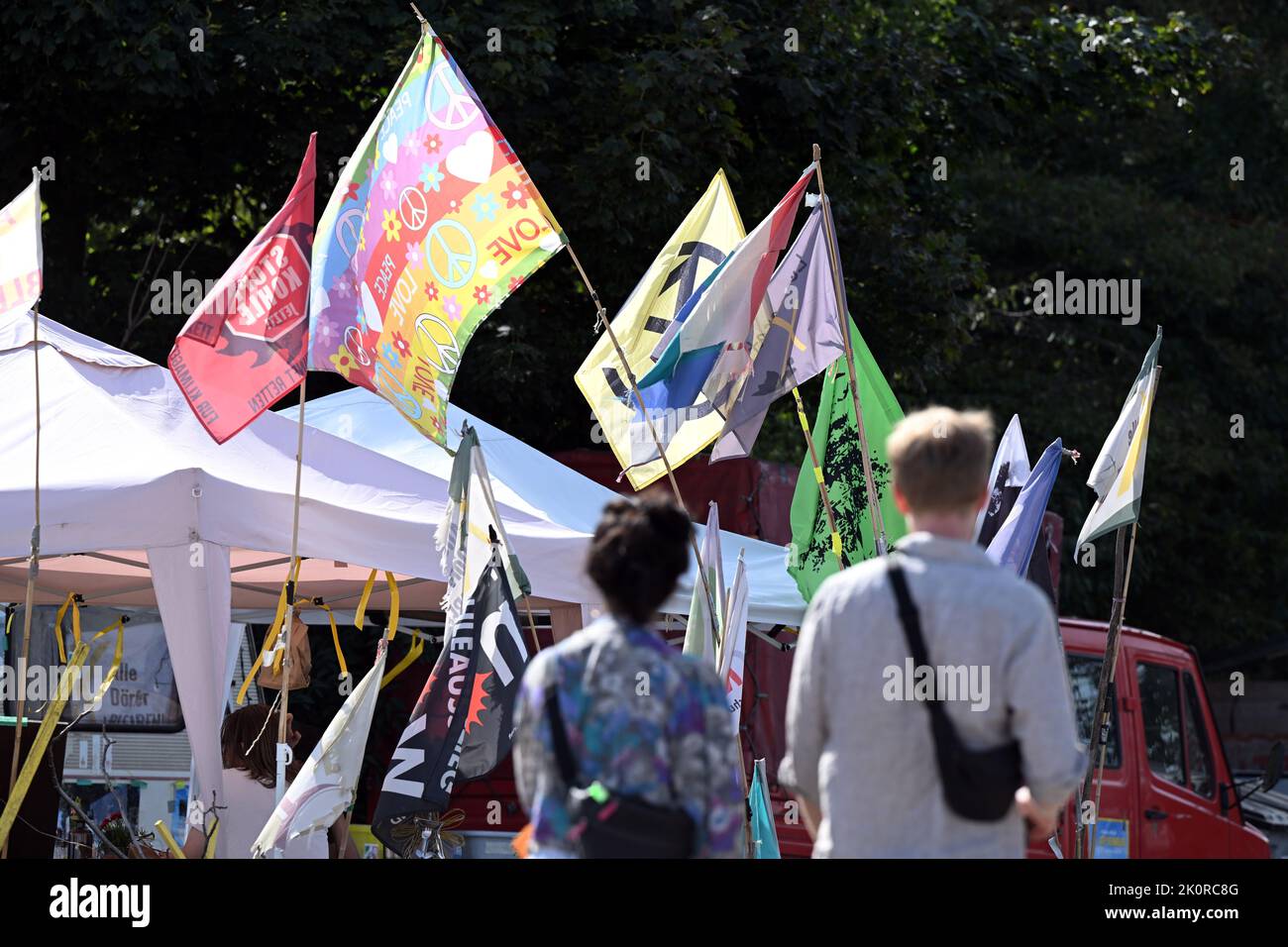13 September 2022, North Rhine-Westphalia, Lützerath: Protest flags fly ...