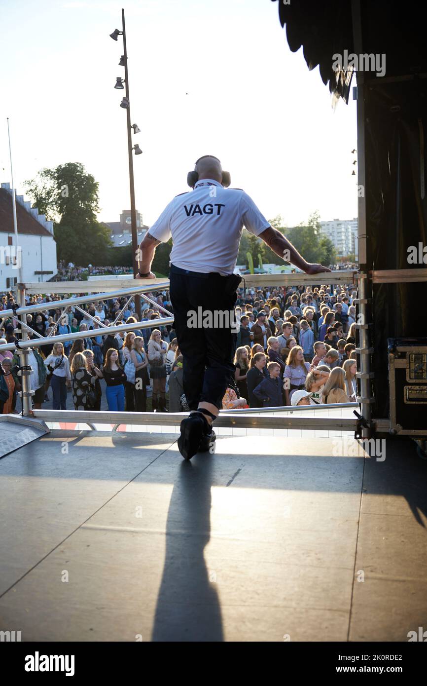 security guard watching crowd at Tobias Rahim concert Stock Photo - Alamy