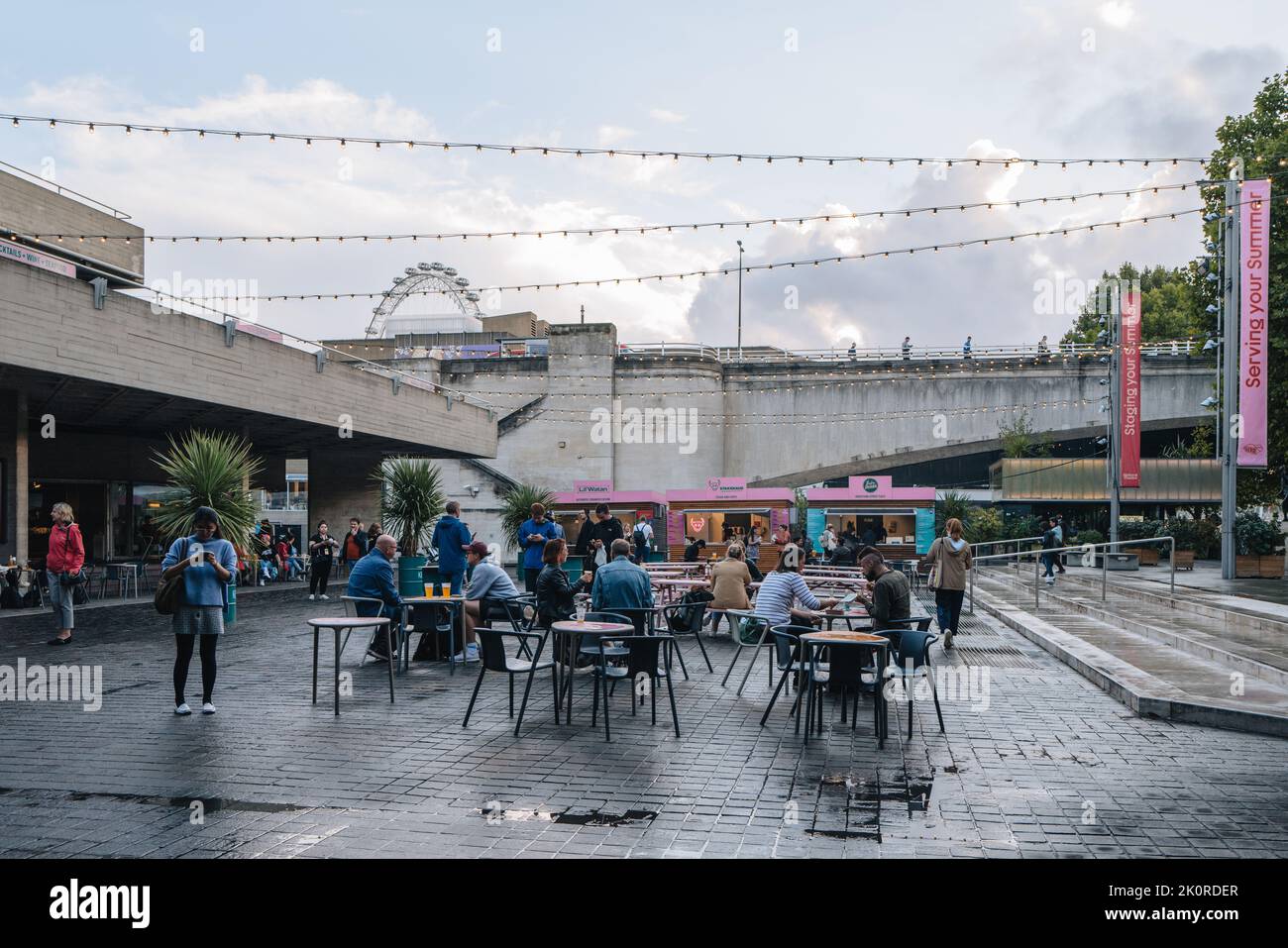 London, UK - September 8, 2022: People at the outdoor tables of Serving ...