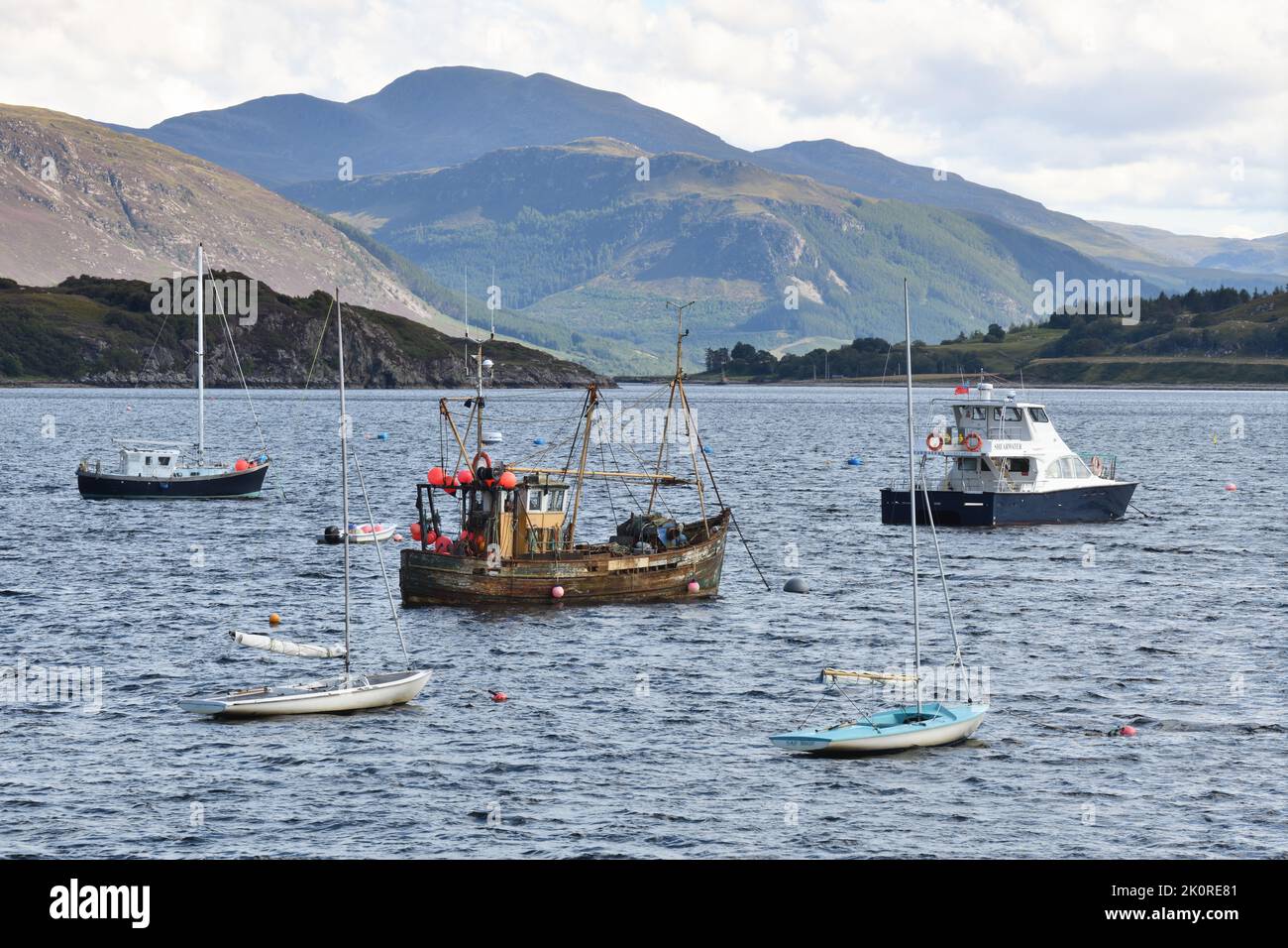 An old fishing boat moored in Ullapool Bay on Loch Broom, Sutherland ...