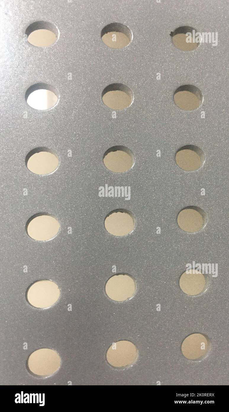 Detail of a perforated sheet Stock Photo - Alamy