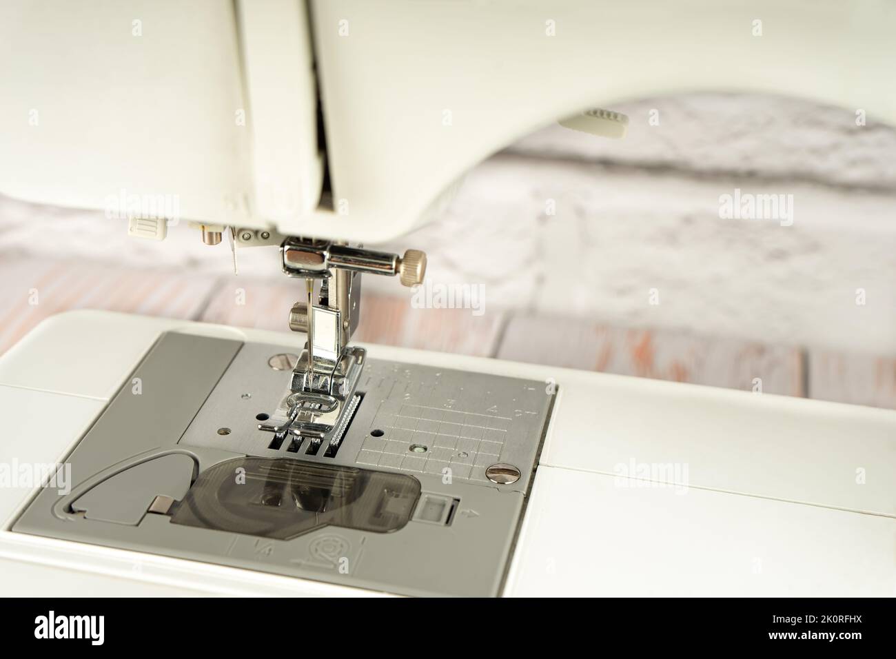 Close-up part of sewing machine, presser food and needle. Workng part ...
