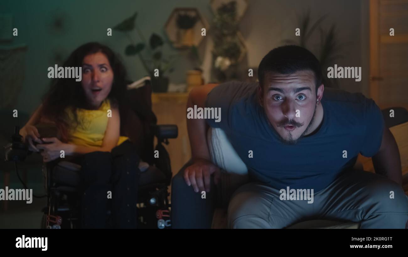 Shocked woman with physical disability in a wheelchair and man ...