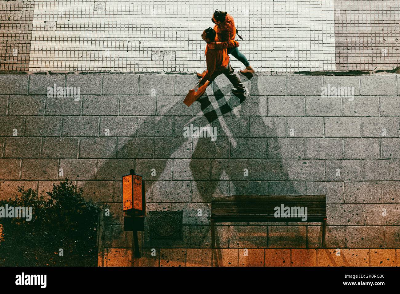2 people on the street taken from above Stock Photo - Alamy