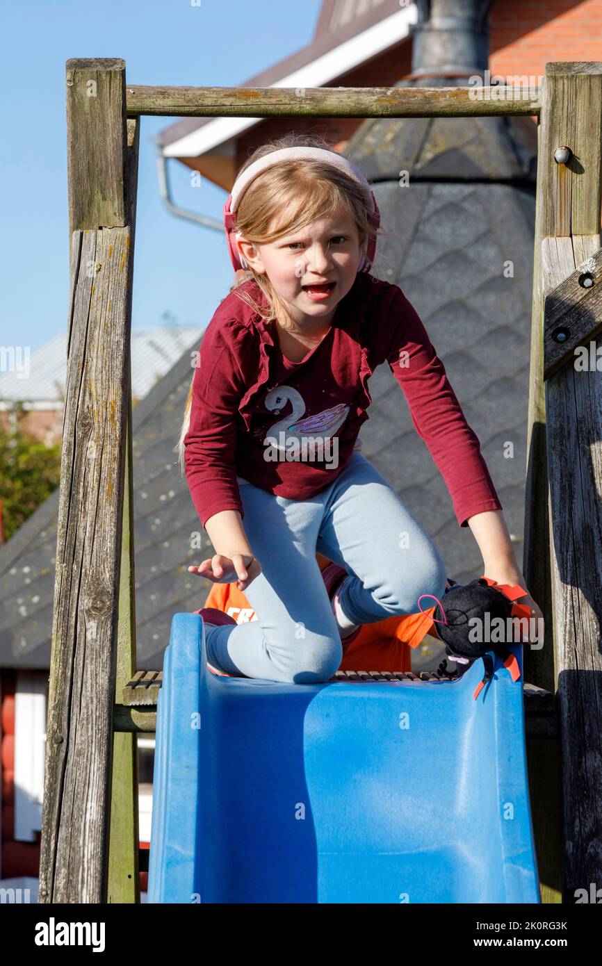 Children playing slide laughing hi-res stock photography and images - Alamy