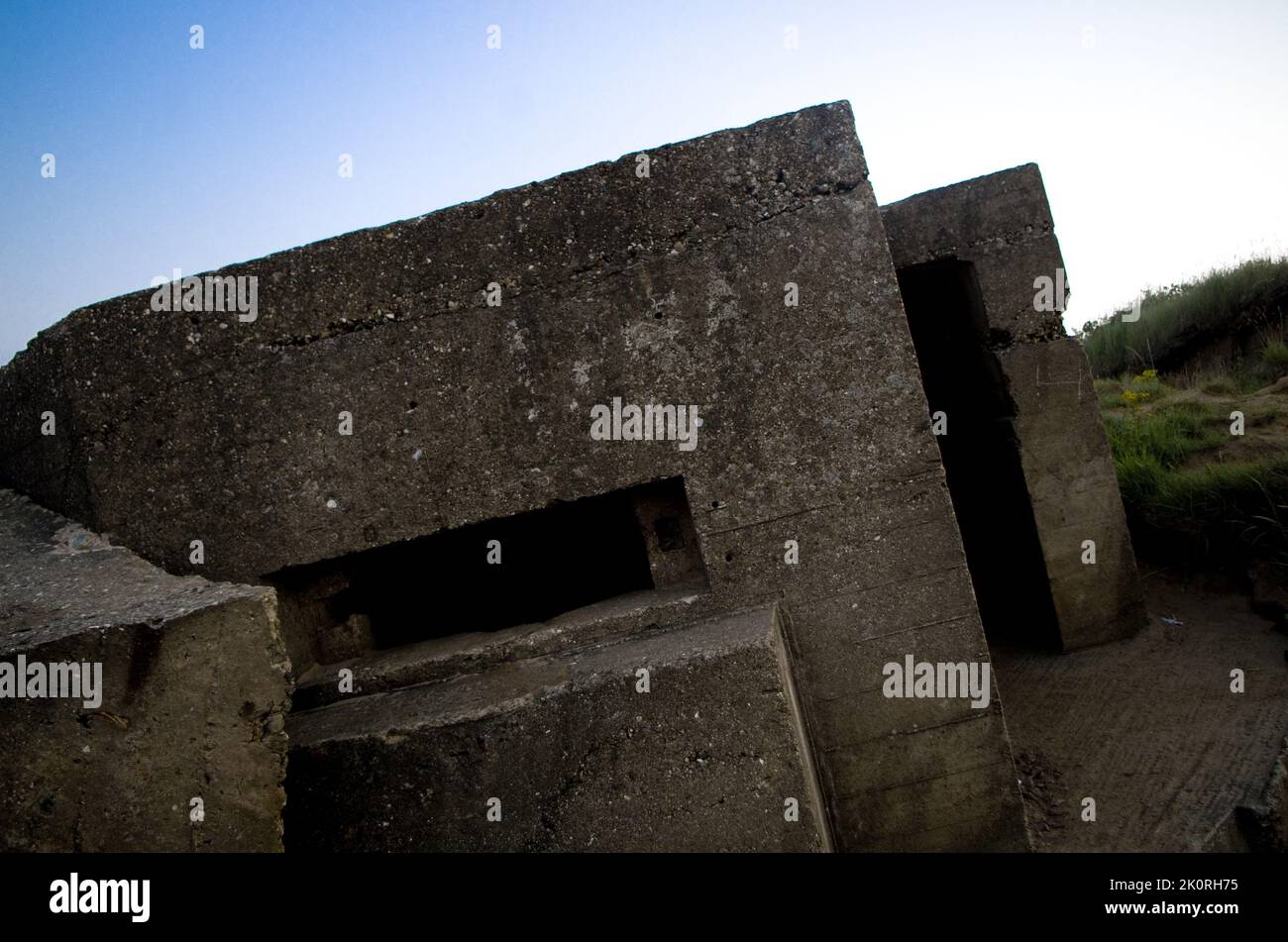 Collapsed WWII pillbox on coast Stock Photo - Alamy