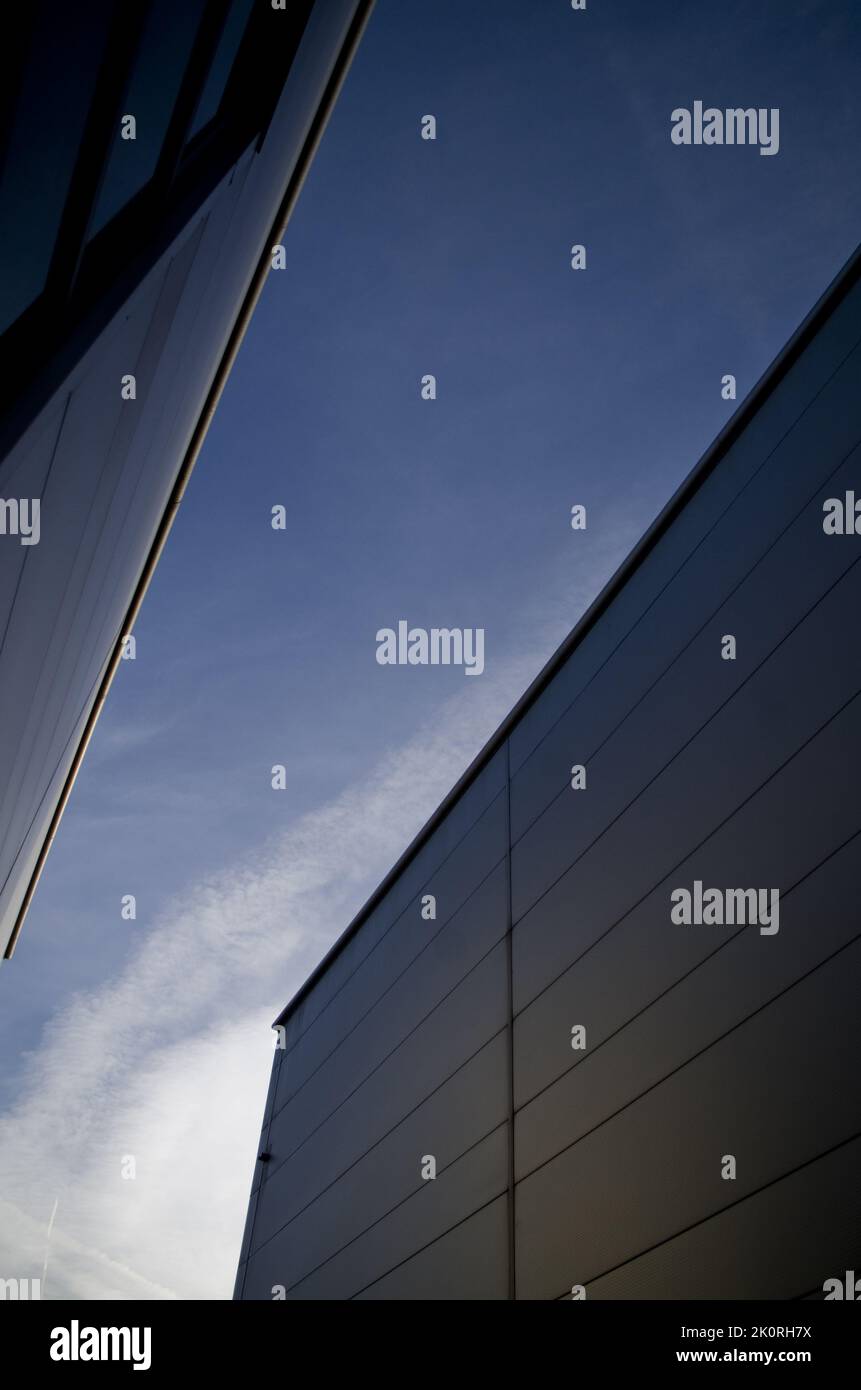Blue sky at sunrise between two generic office buildings Stock Photo ...
