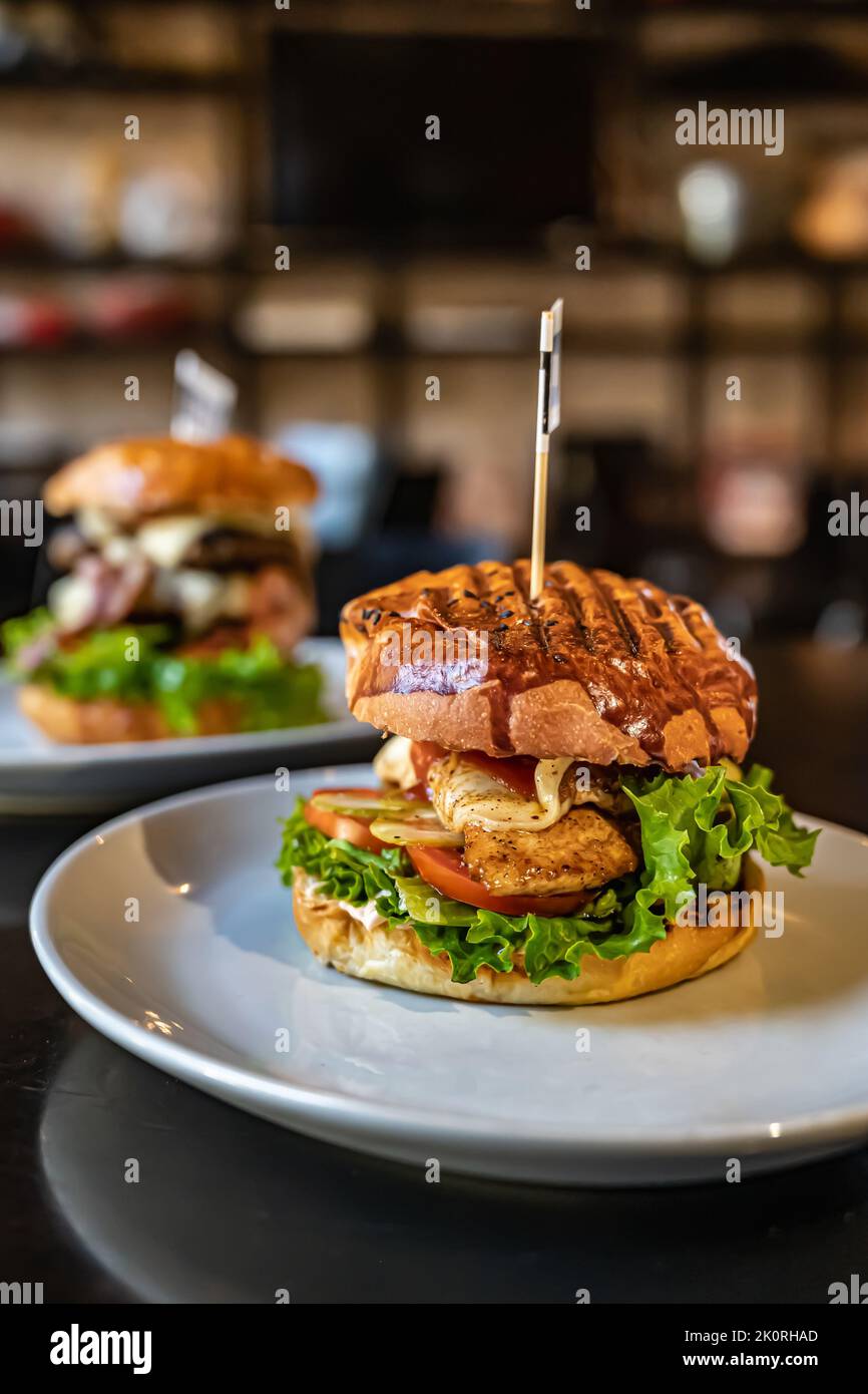 Delicious craft burgers made from fresh beef served on a white plate ...