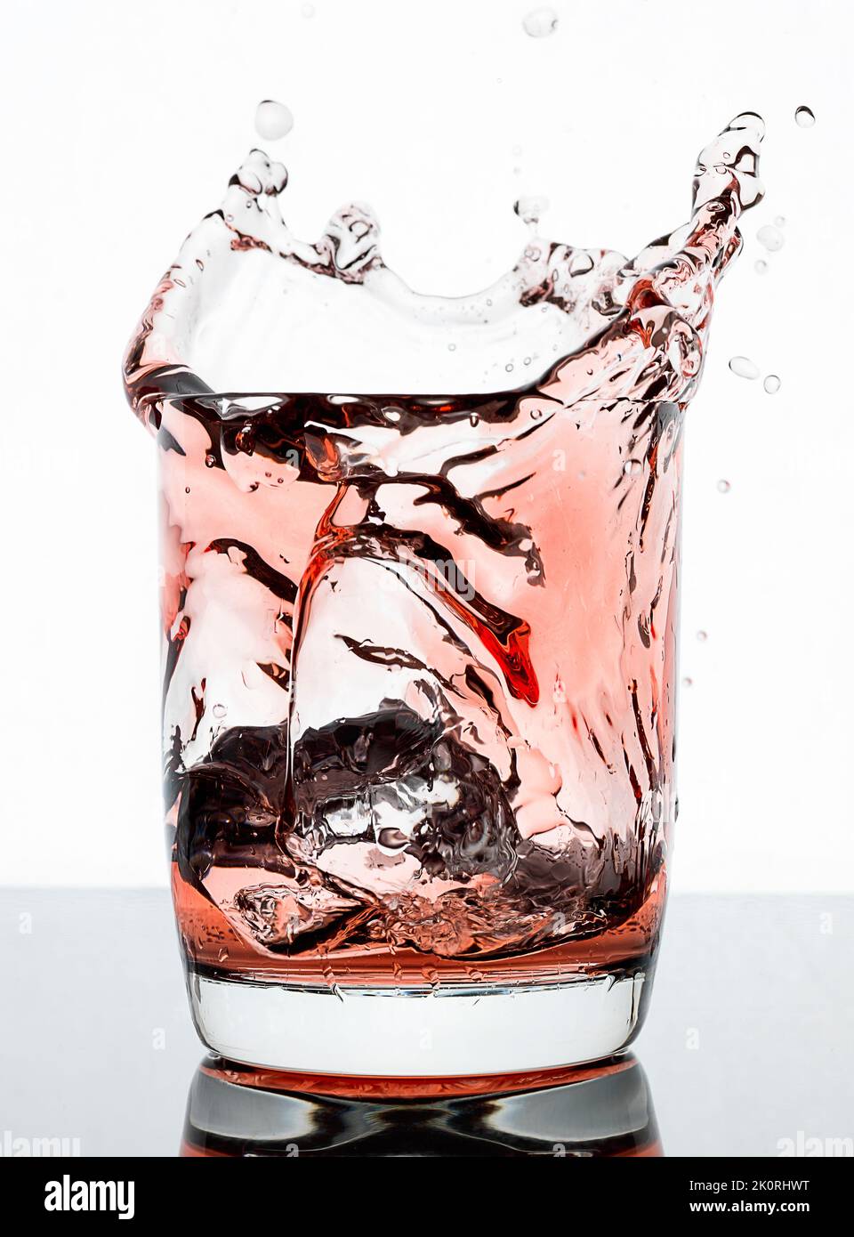 High speed captures of ice cubes dropping into glasses of drinks. Check ...