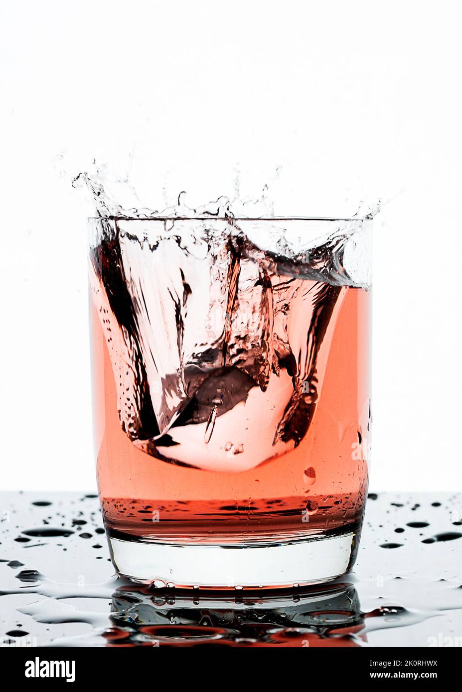 High speed captures of ice cubes dropping into glasses of drinks. Check ...