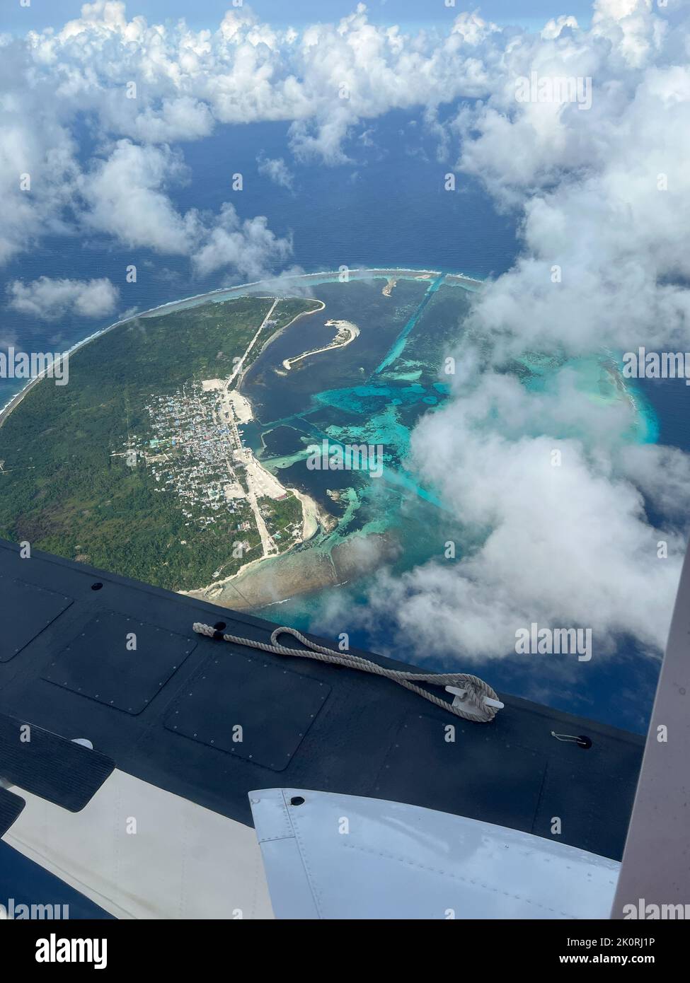 An aerial view of a tropical island in the Maldives, during a seaplane ...