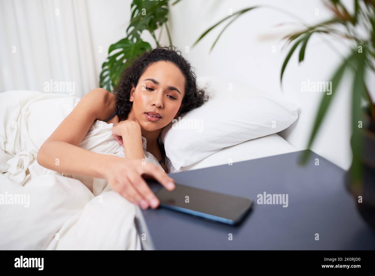 Phone alarm wakes up woman hi-res stock photography and images - Alamy