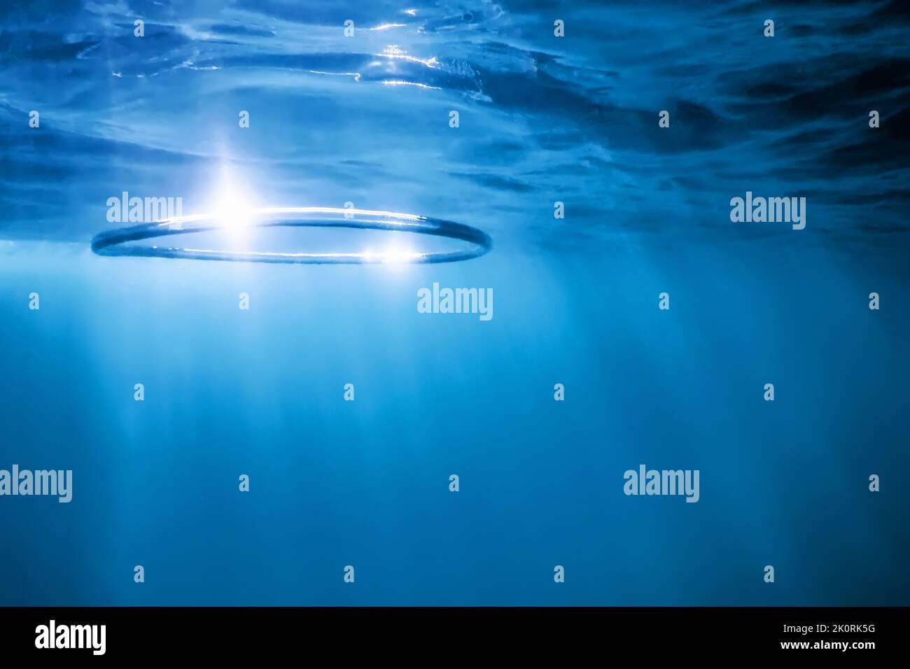 Underwater Bubble Ring Ascends towards the Sun Stock Photo - Alamy