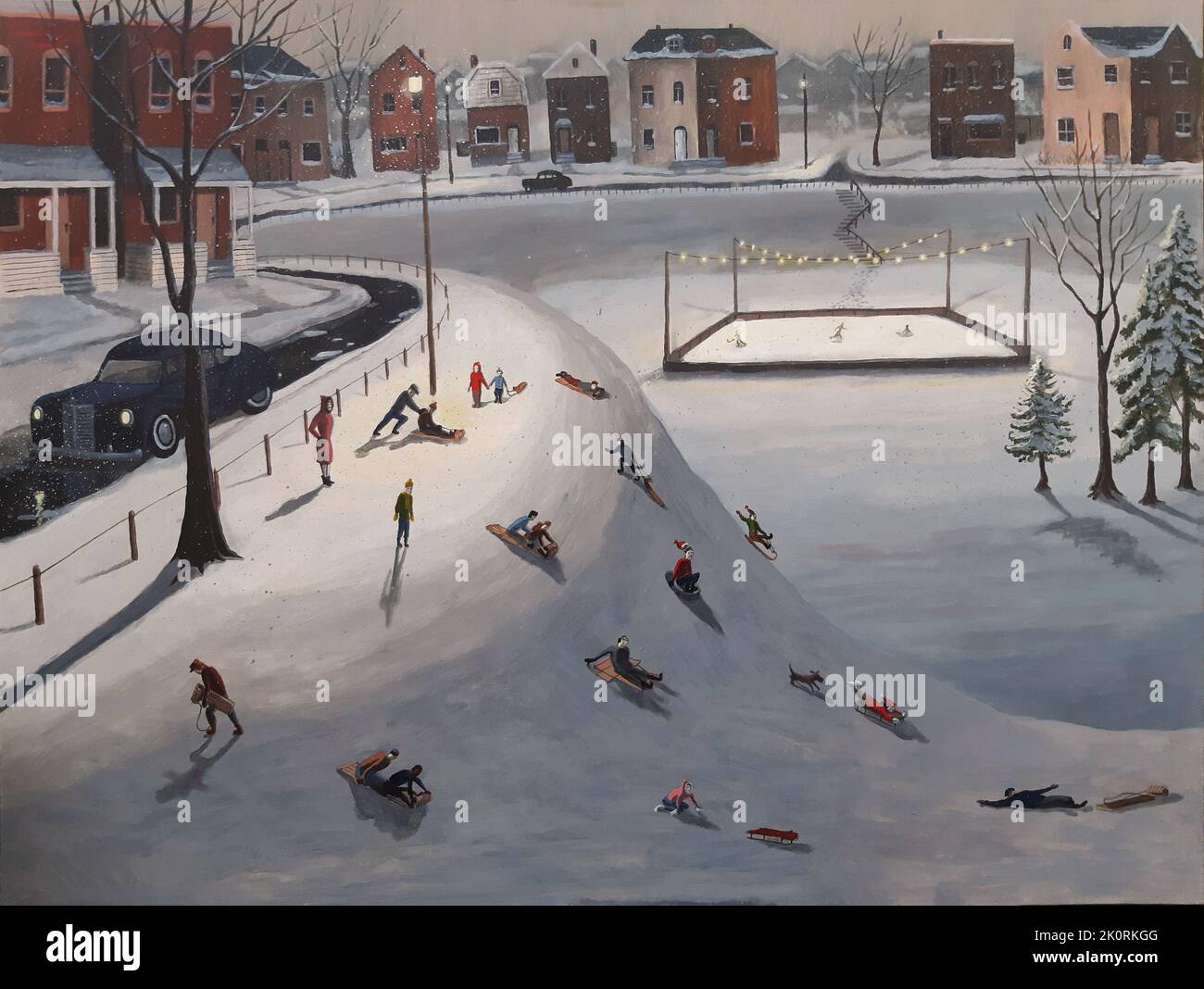 Vintage 1940s scene of neighbourhood kids tobogganing at night on a ...