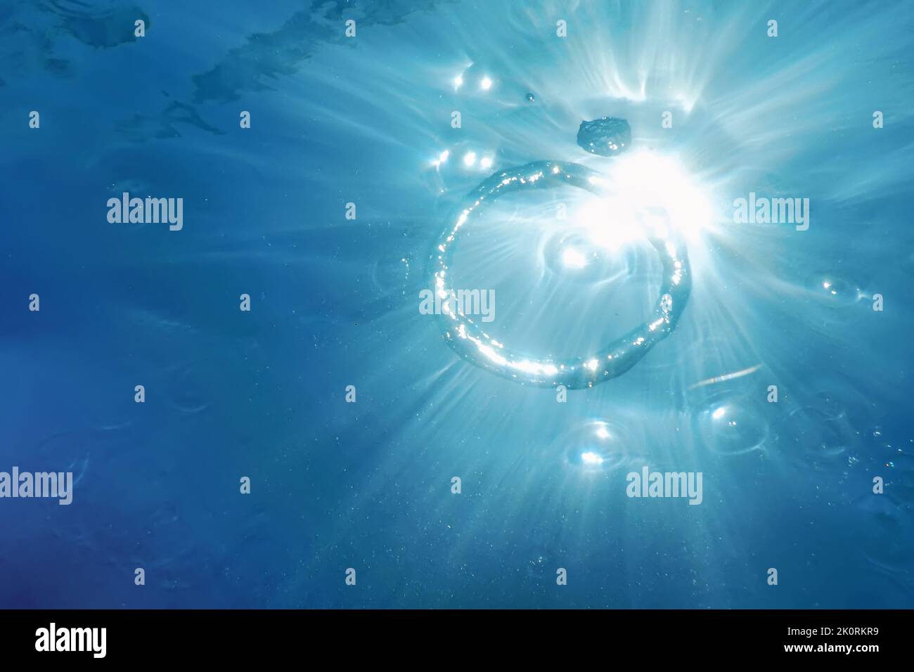 Underwater Bubble Ring Ascends towards the Sun Stock Photo - Alamy