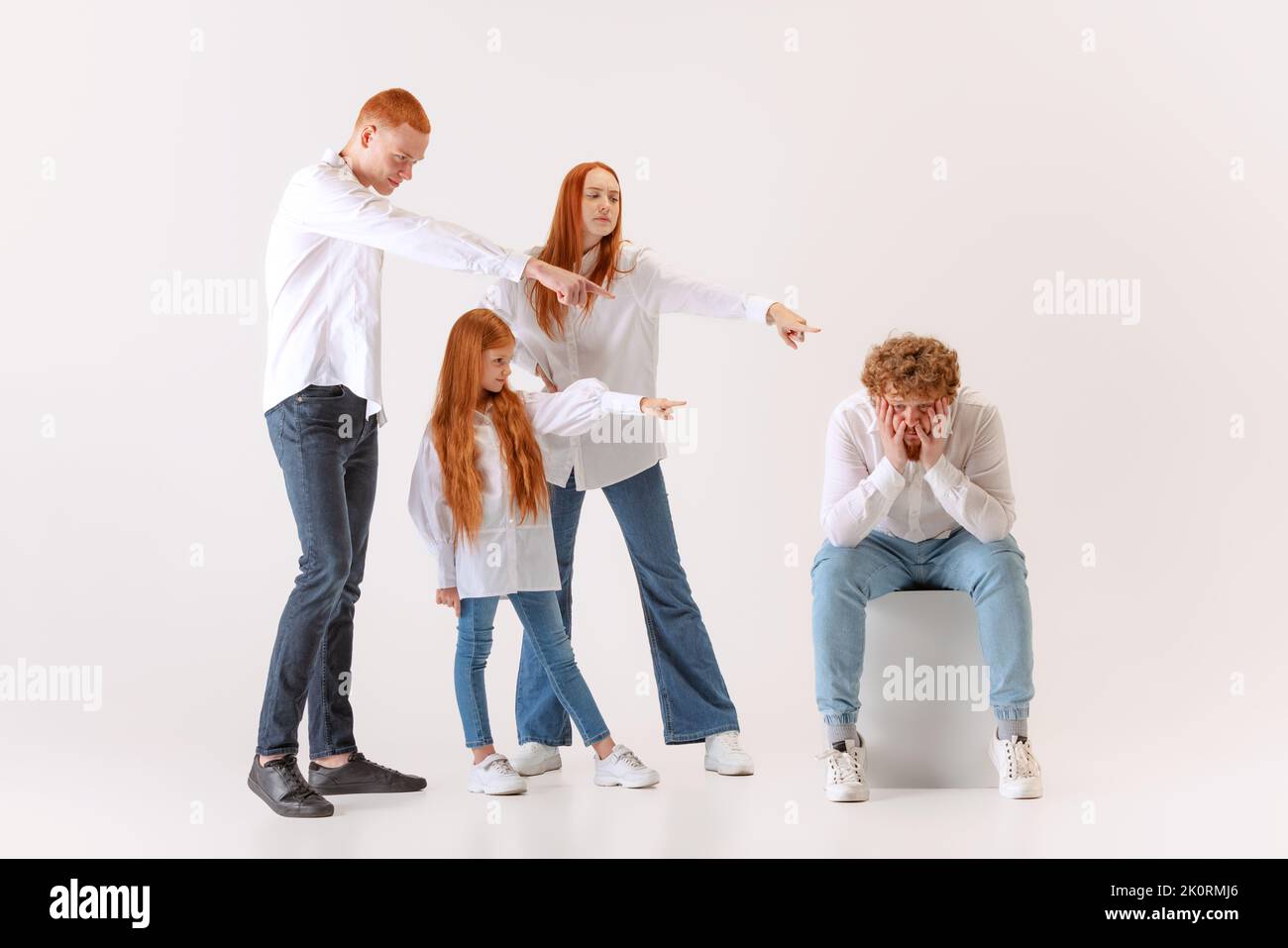 Two men and woman and kid, red-headed young people wearing casual style ...