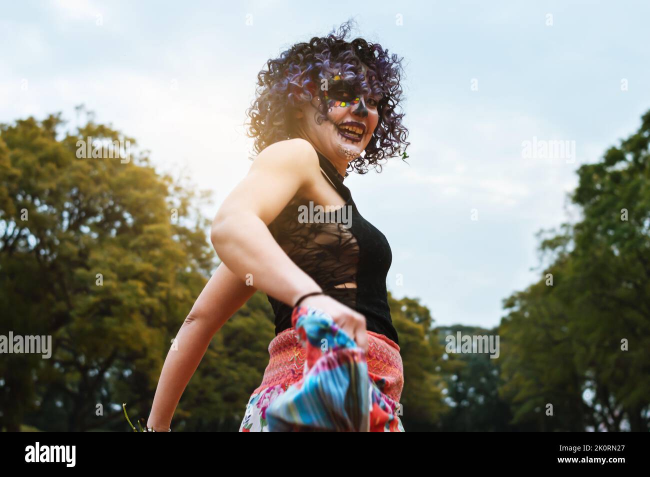 young latin caucasian woman with skirt and La Calavera Catrina makeup ...