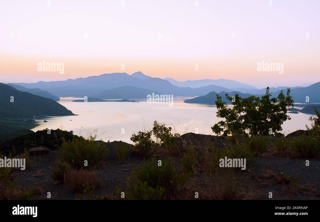 Lake and mountains after sunset Stock Photo - Alamy