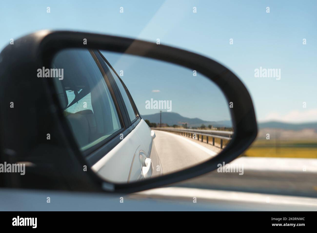 Side car mirror reflecting road Stock Photo - Alamy