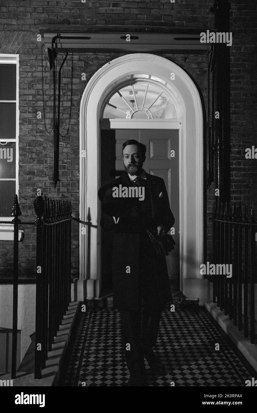 Victorian Man leaving house Nighttime Stock Photo - Alamy