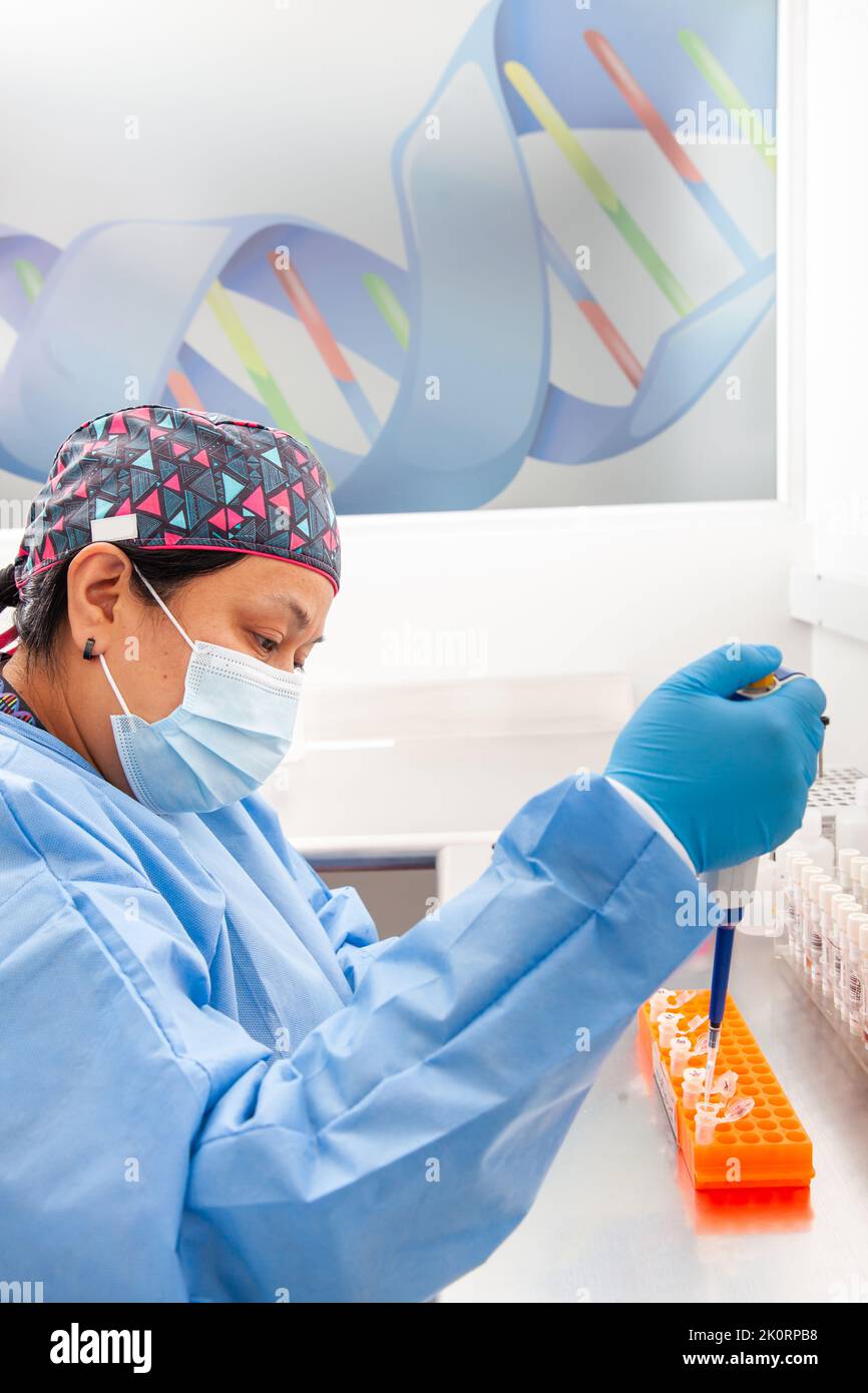 Female Scientist Extracting Dna Using The Spin Column Based Nucleic Acid Purification Technique