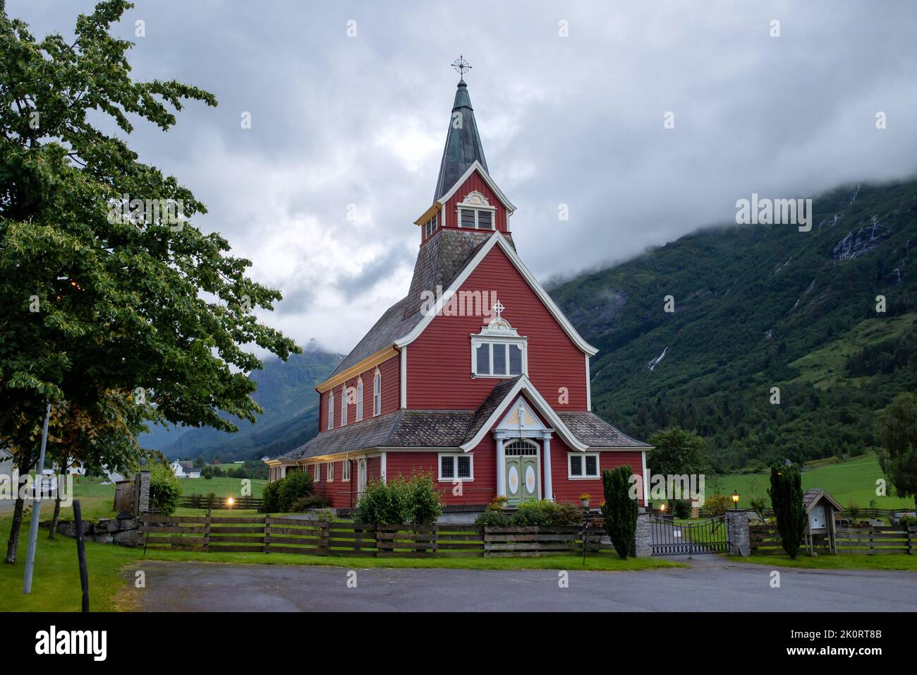 Cemetery with church in Norway on sunset Stock Photo - Alamy