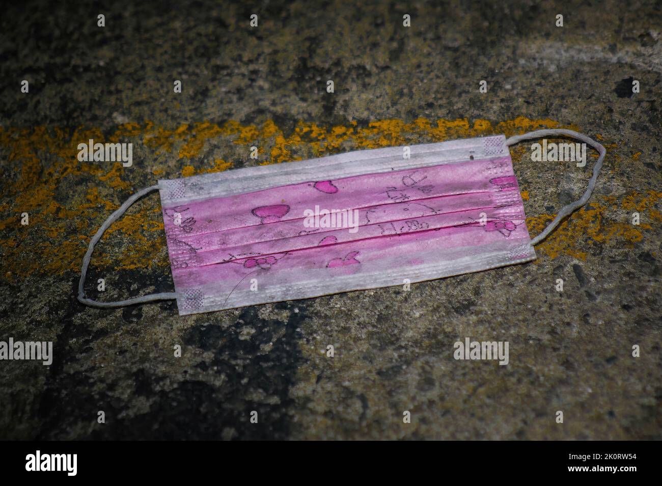 Used face mask seen unproperly discarded along the street of Downtown ...