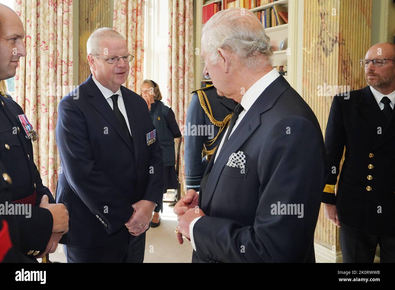 King Charles III meets PSNI Cheif Constable Simon Byrne during a ...