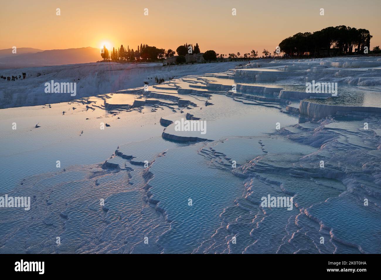 sunset behind Pamukkale travertine terraces, Denizli, Turkey Stock ...