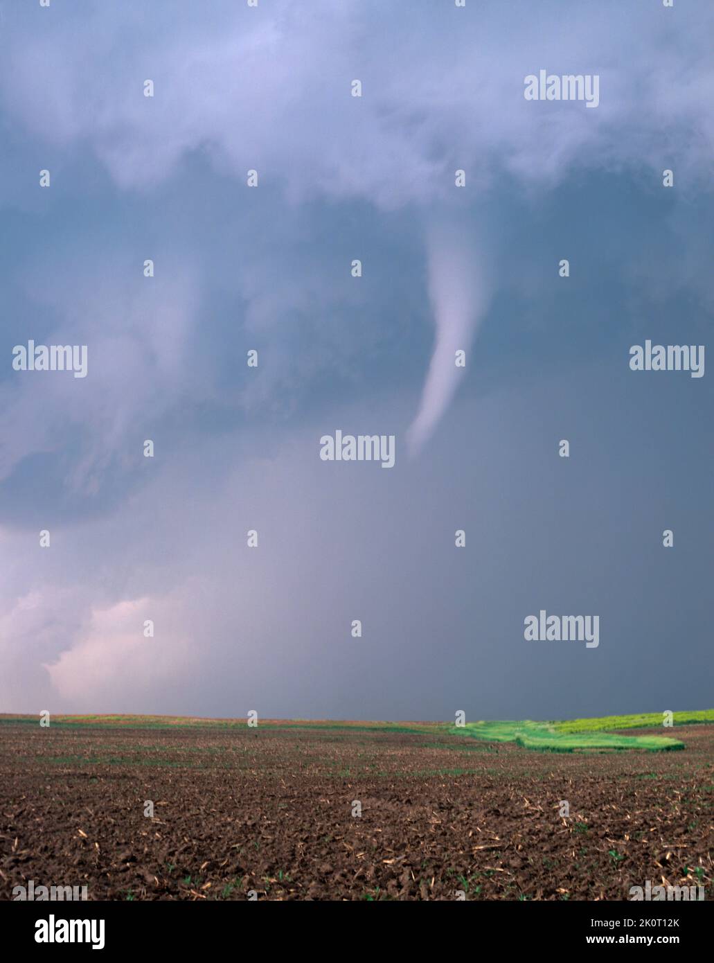 A beautiful funnel cloud forms underneath a supercell thunderstorm in ...