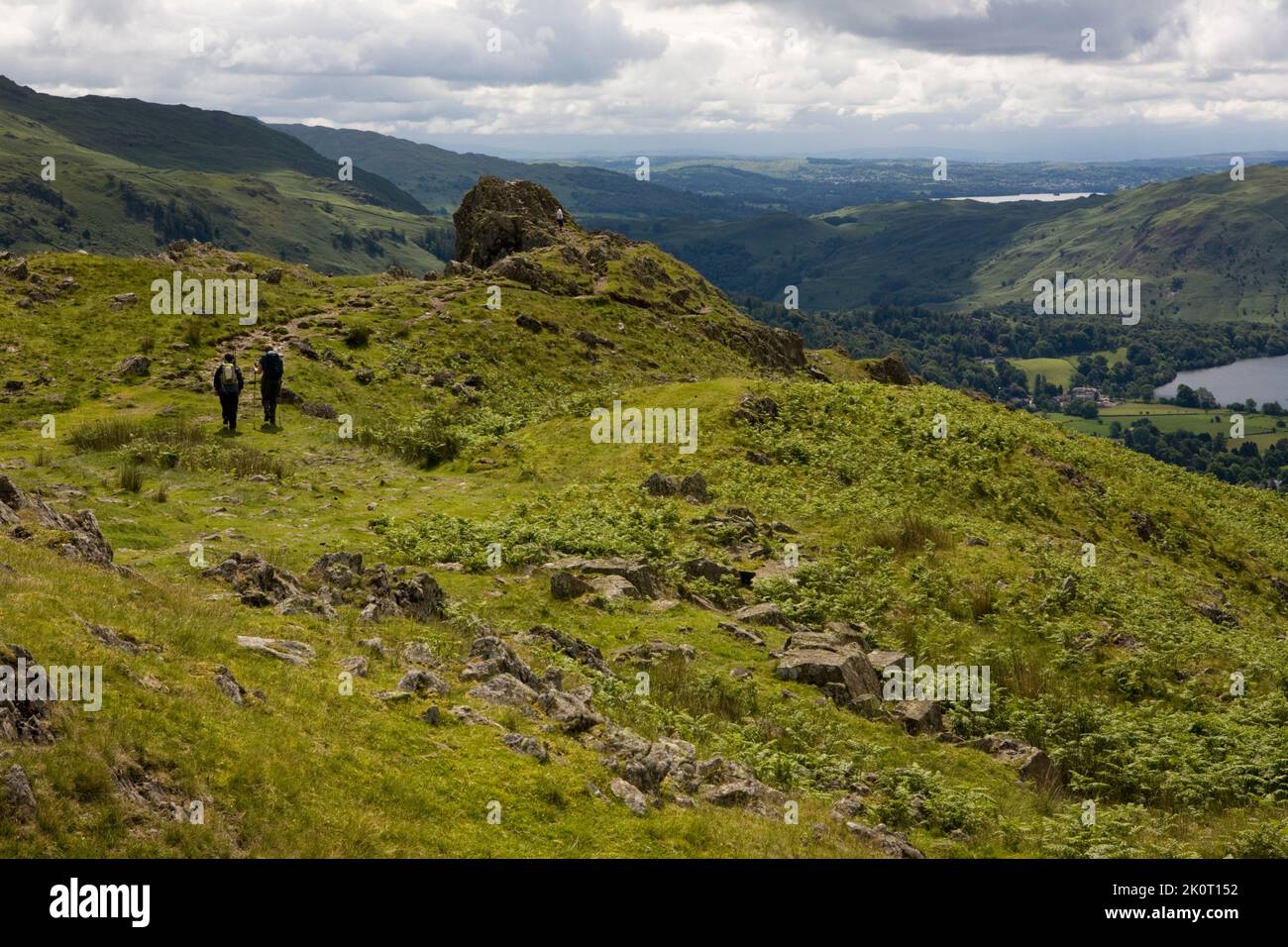 Two walkers descend from the top of Helm Crag, known locally as "The ...