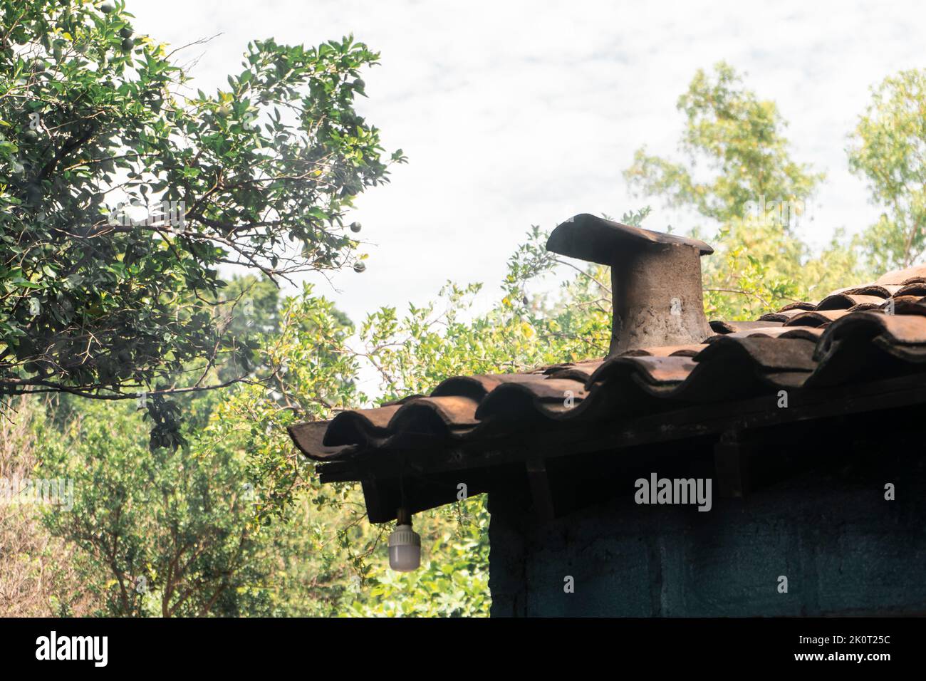 Chimney on a clay tile roof in a rural area of Latin America Stock ...