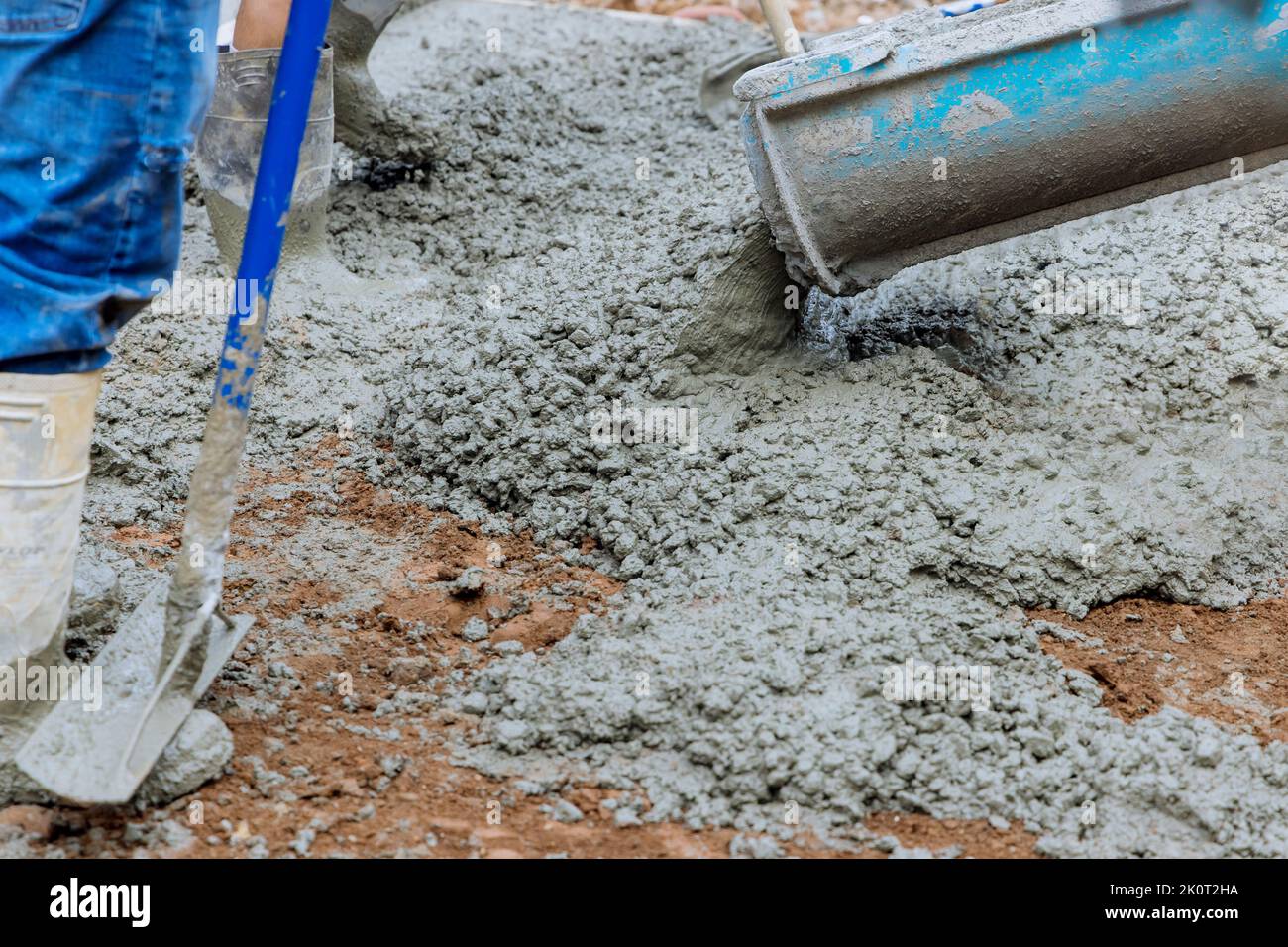 Worker pour pouring concrete parking for car Stock Photo - Alamy