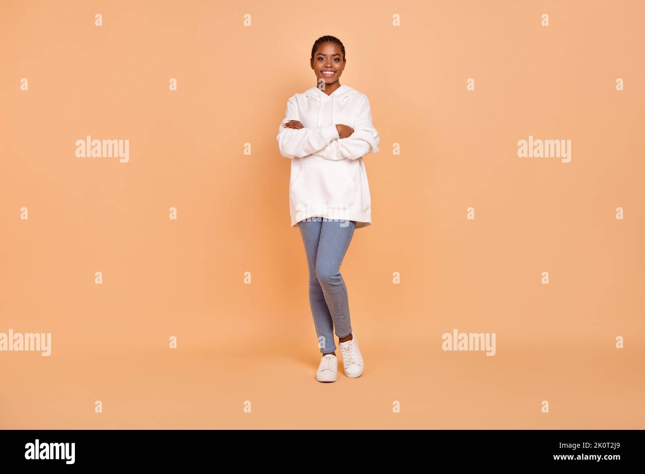 Full body portrait of satisfied charming person crossed hands beaming ...