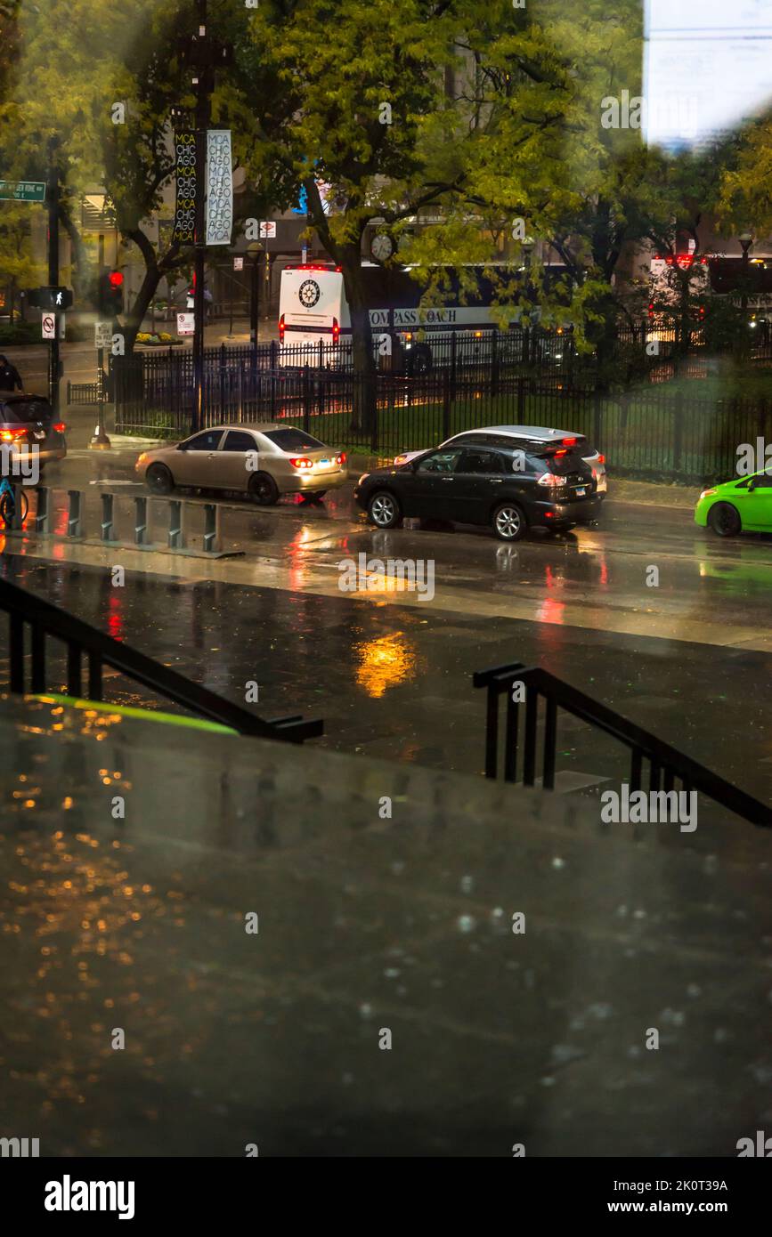 Downtown traffic at night in the rain, Chicago, Illinois, USA Stock ...