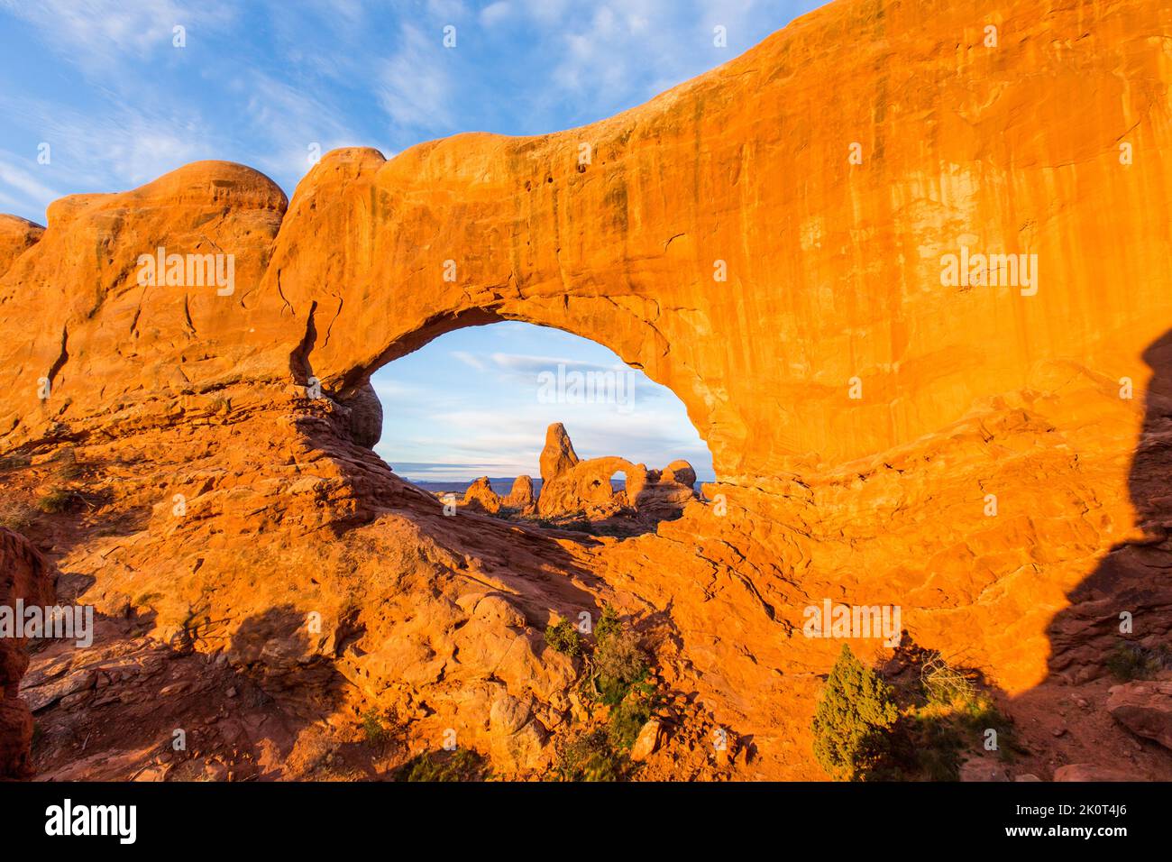 Turret Arch framed by the North Window at sunrise. Arches National Park ...