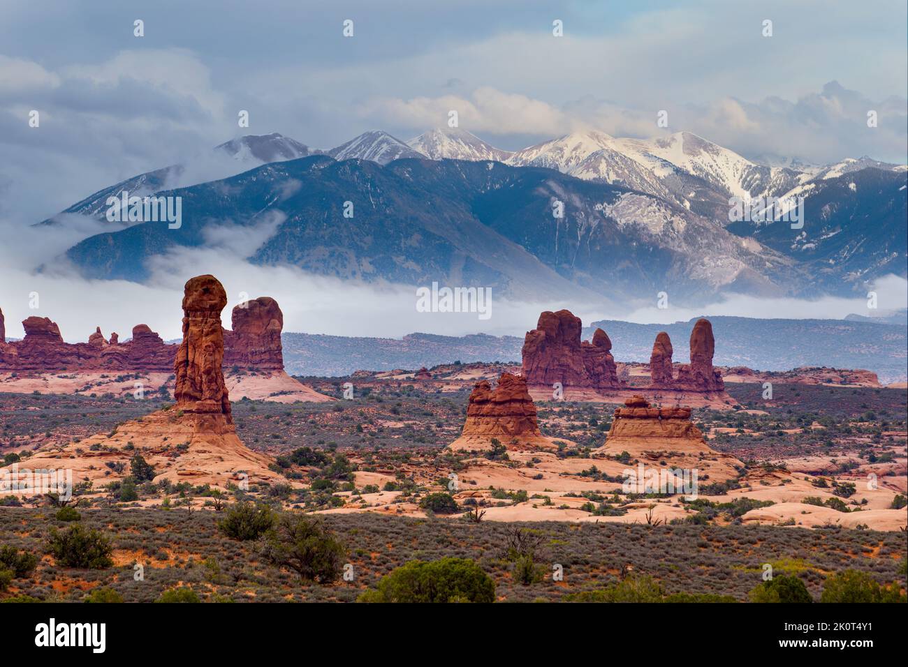 Entrada sandstone rock spires in Arches National Park with low clouds ...
