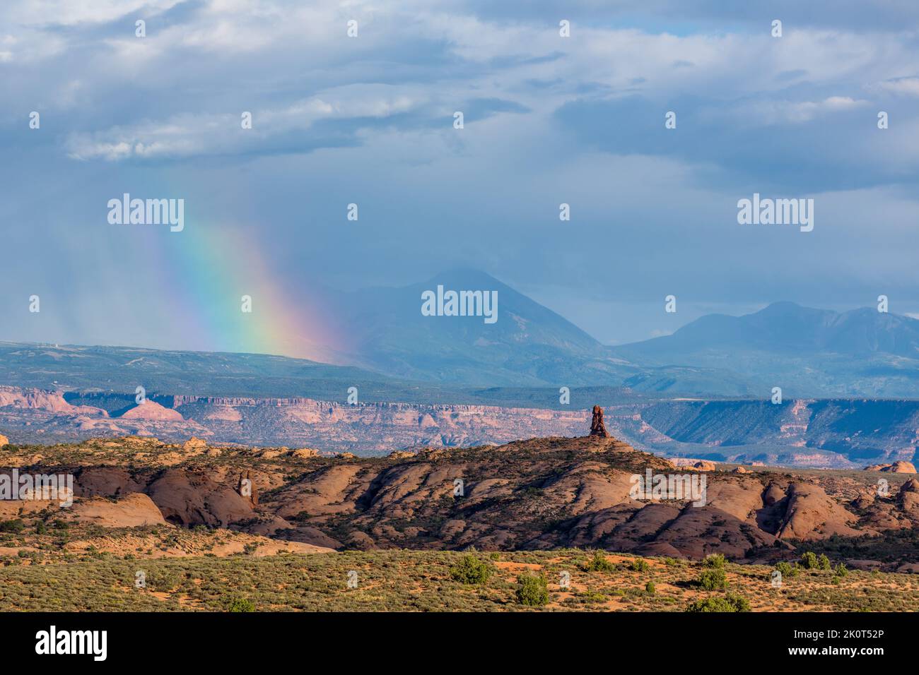 An unnamed Entrada sandstone rock spire in Arches National Park with a ...