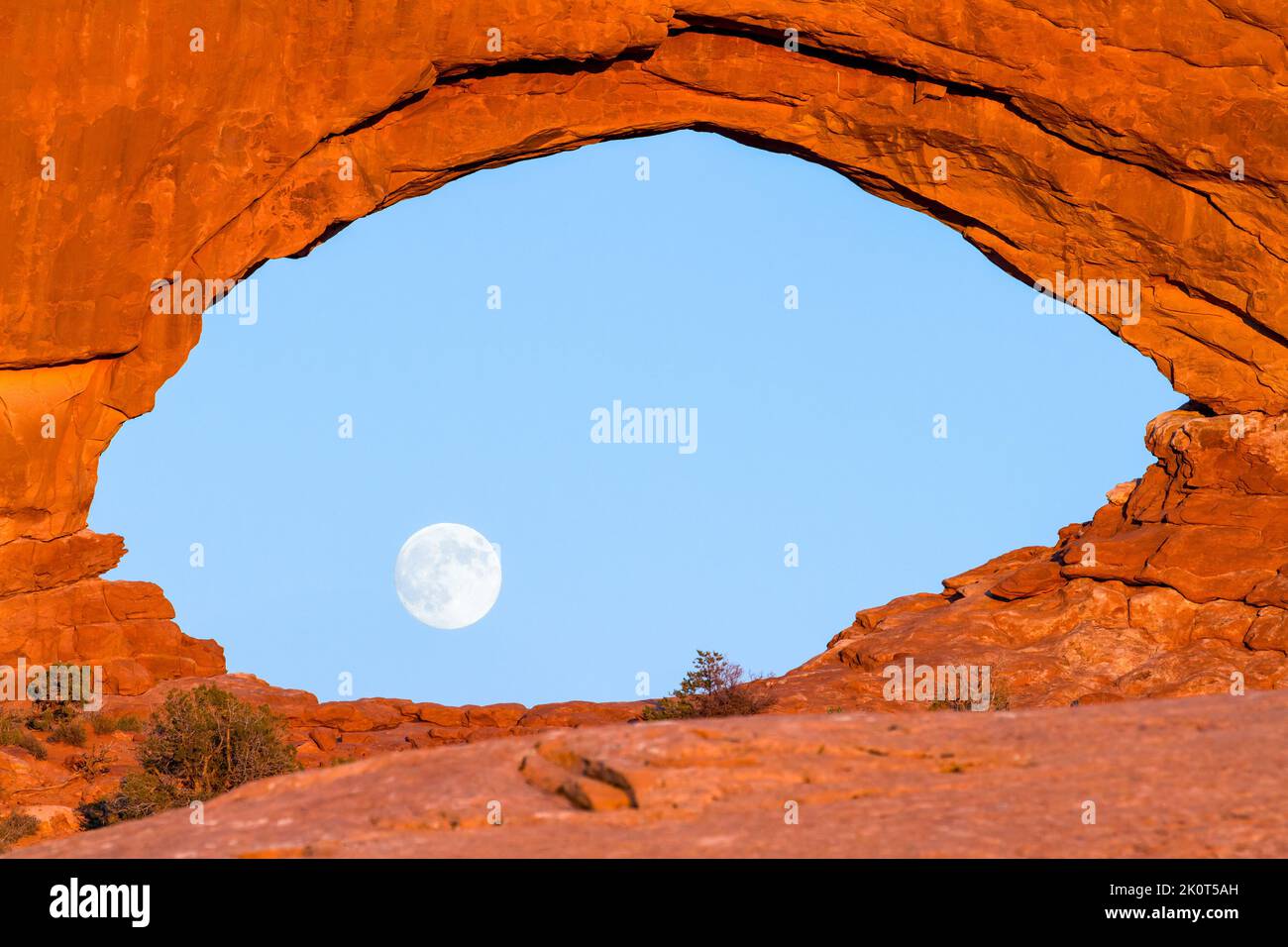 Moon rising in the North Window, an Entrada sandstone arch in the ...