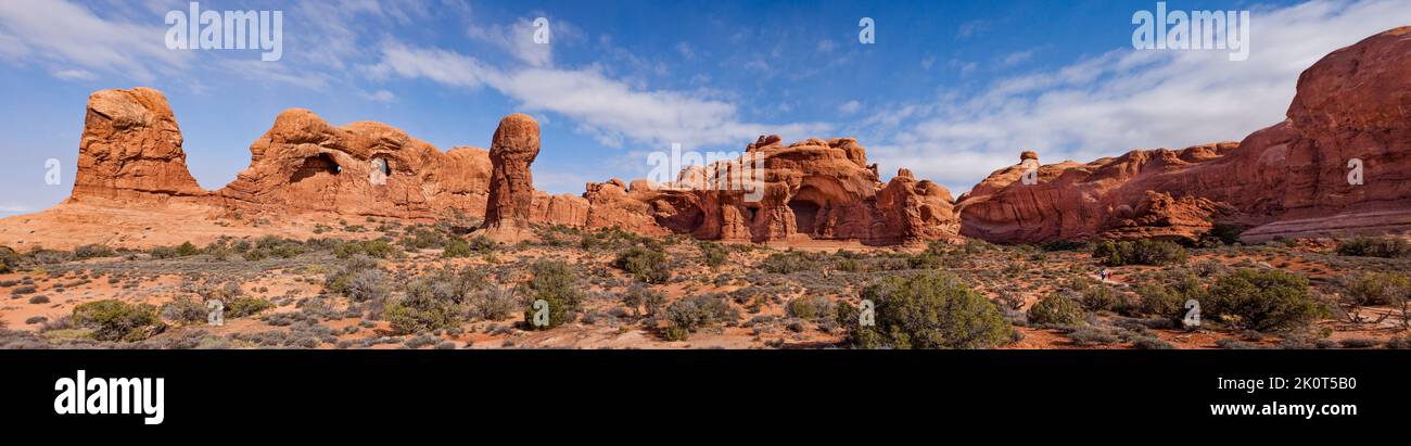 A sandstone rock spire with Double Arch, center, in the Windows Section ...