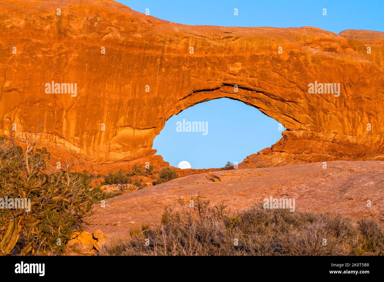 Moon rising in the North Window, an Entrada sandstone arch in the ...
