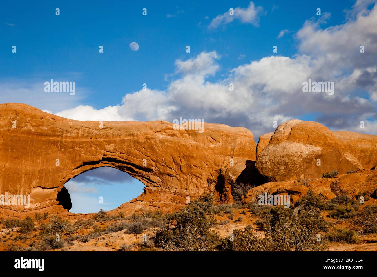 Moon above the North Window, an Entrada sandstone arch in the WIndows ...