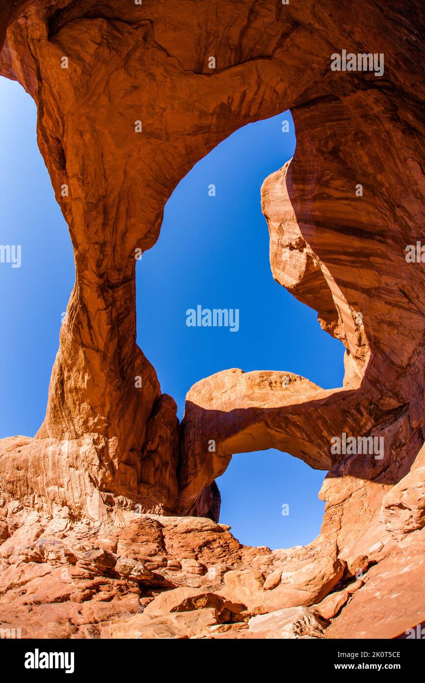 Looking up from beneath Double Arch, an Entrada sandstone arch in the ...