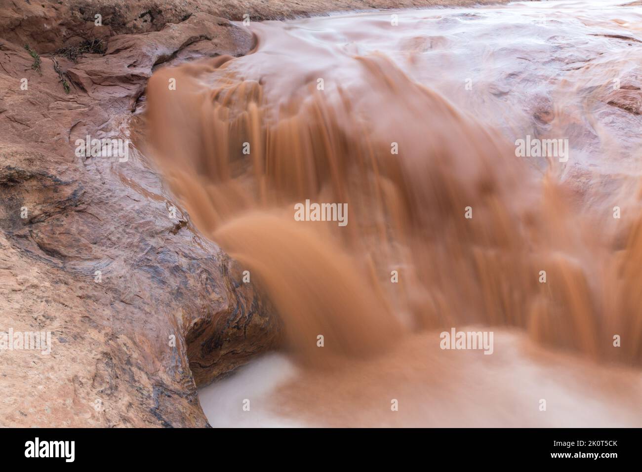 A flash flood in the desert after a heavy rain in Arches National Park ...