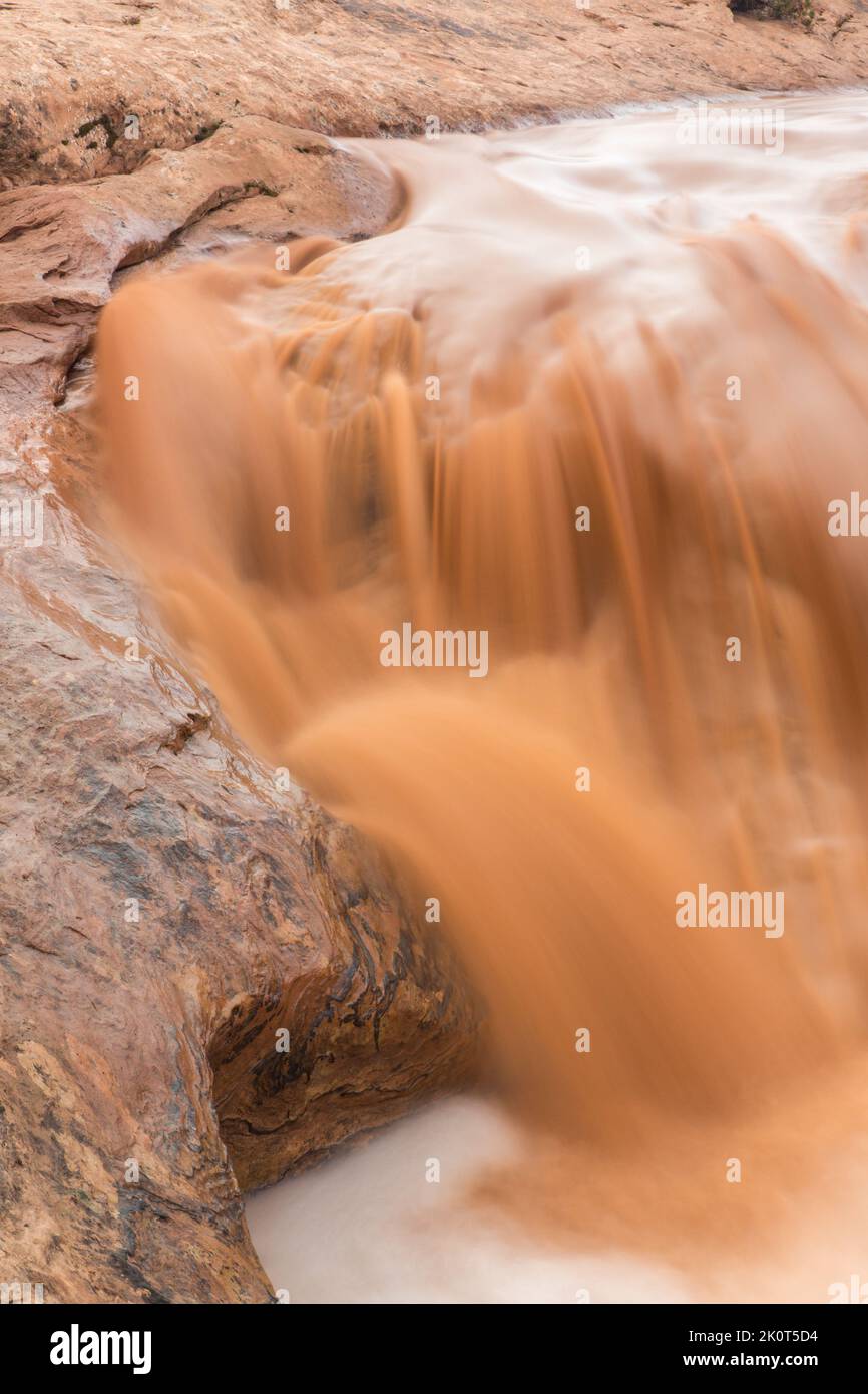 A flash flood in the desert after a heavy rain in Arches National Park ...