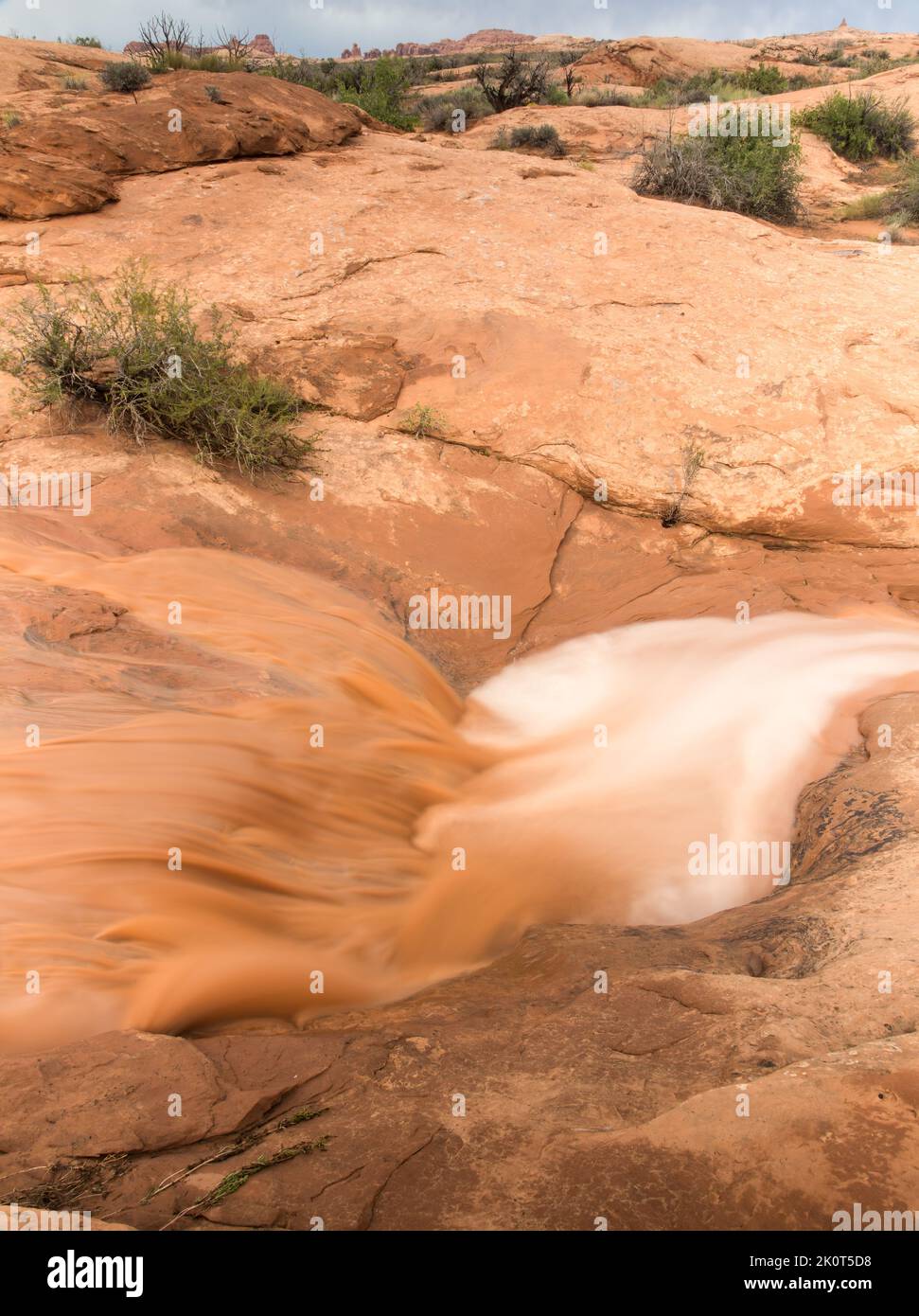 A flash flood in the desert after a heavy rain in Arches National Park ...